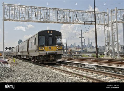 Lirr M7 Train Travels Down New Relocation Mainline Track And Under Signal Bridge As Part Of The