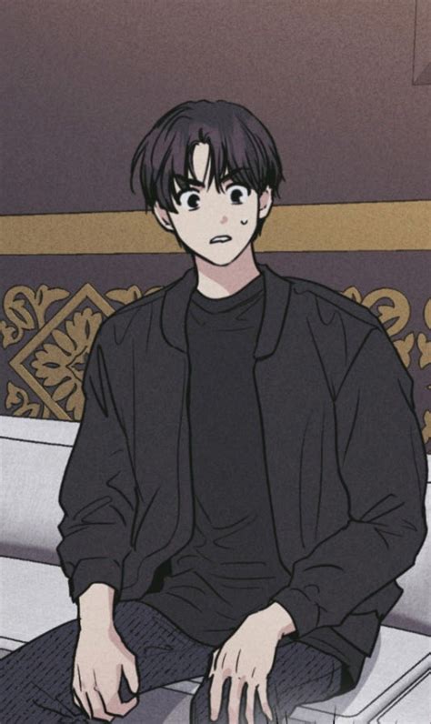 A Man Sitting On Top Of A White Couch