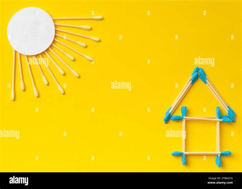 Composition Of Cotton Swabs And Discs On A Yellow Background The