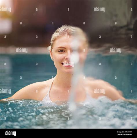 Letting Off Some Steam In Luxury A Young Woman Relaxing In The Jacuzzi