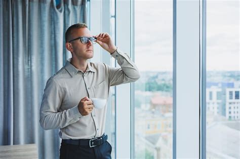 Premium Photo Modern Office Businessman Or Manager Drinking Coffee By
