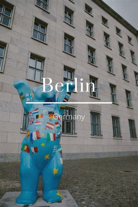 An Elephant Statue In Front Of A Building With The Words Berlin On Its