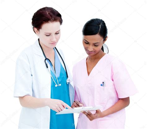 Assertive Female Doctor And Nurse Studying A Patients Folder — Stock