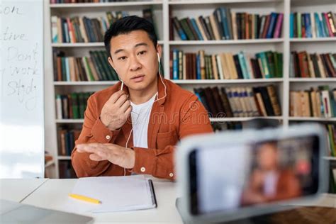 Japanese Male Teacher Having Remote Lecture Via Phone In Classroom Stock Image Image Of
