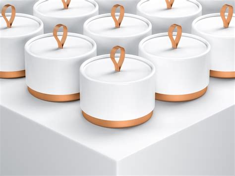 테이블에 황금 루프가 있는 흰색 원통형 튜브 상자 포장 모형 3d 렌더링 프리미엄 사진