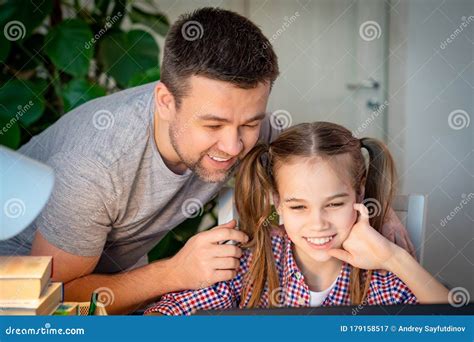 Daddy Helps Daughter With Online Lessons On Laptop Stock Image Image
