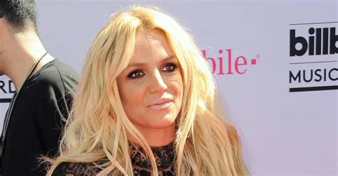 Britney Spears Poses Topless In A Thong Photo