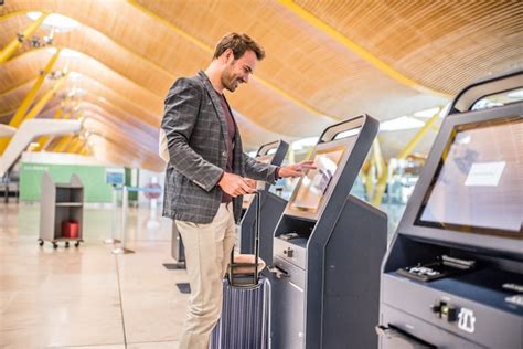 Premium Photo Happy Man Using The Check In Machine At The Airport