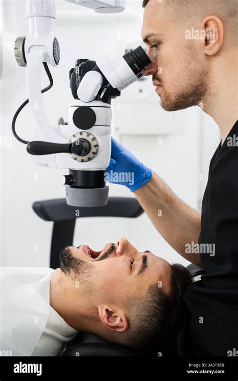 Surgical Microscope Examination Procedure Dentist Is Looking On Teeth