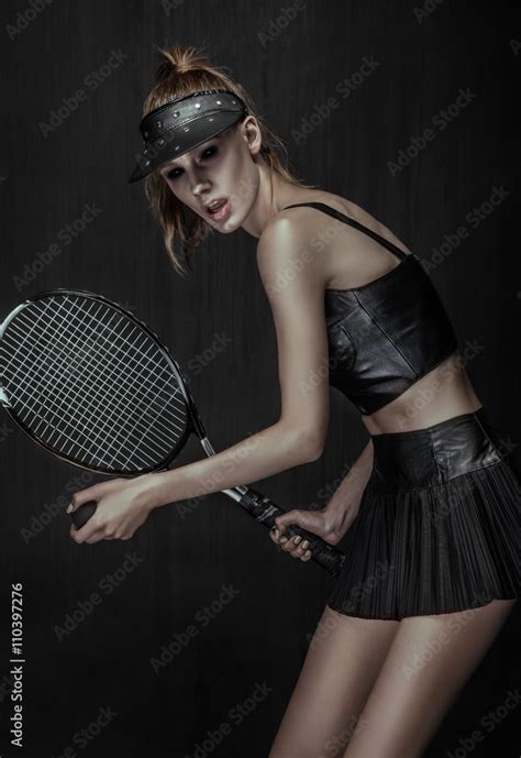 Sexy Tennis Player Girl In Black Leather Clothes With Tennis Racket