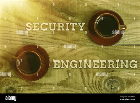 Hand Writing Sign Security Engineering Word Written On Focus On The Security Aspects In The