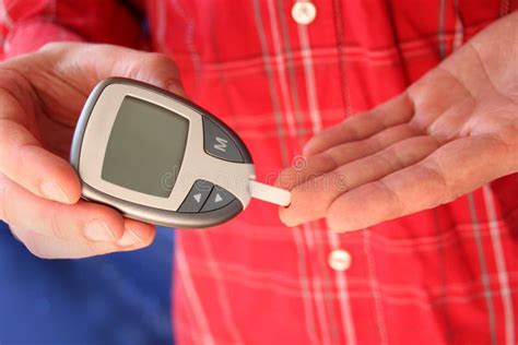 Male Hands Closeup A Man Makes A Test With A Glucometer Medical Concept Control Of Blood