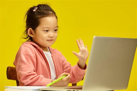 Premium Photo Engaged Asian Ethnicity Young Learner Participates In