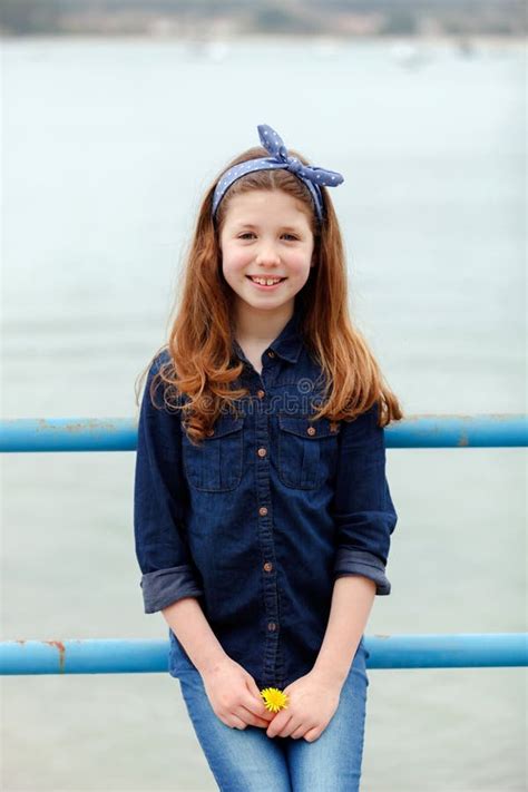 Beautiful Girl With Ten Years Old Enjoying Of A Beautiful Day Stock