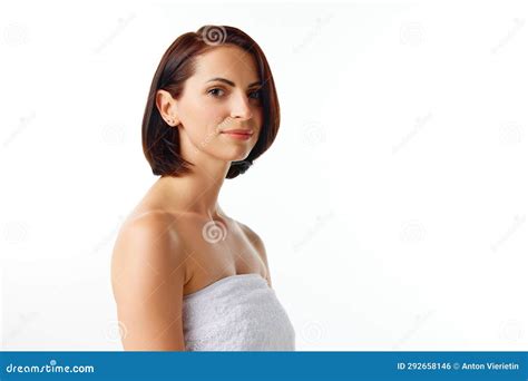 Young Woman With Naked Shoulders And Natural Facial Makeup Looking At Camera Beauty Face Clean