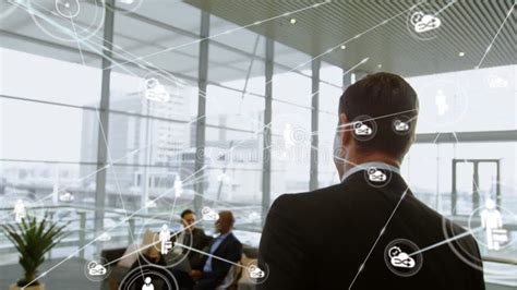 Animation Of Connected Icons With Lines Over Rear View Of Businessman