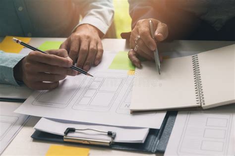 Ux Or Ui Designers Designing On Their Smartphone Application Layout