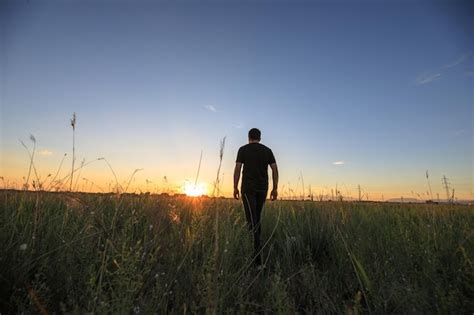 Premium Photo Man Field At Sunset
