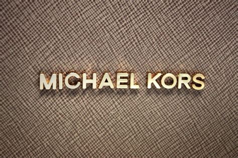 Michael Kors Logo On Textured Background
