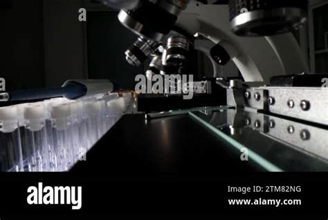 Closeup Of Observing Magnification Of Lens Of Scientific Microscope In