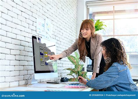 Creative Web Designer Team Collaborating And Planning Template Layout For Mobile Application In