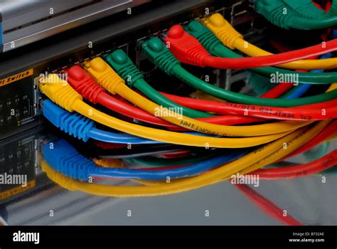Brightly Colored Ethernet Cables Plugged Into A Network Router Stock