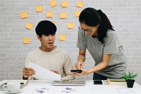 Man Woman Colleagues Analyzing Data On Computer Startup Teamwork Team Working At Office Stock