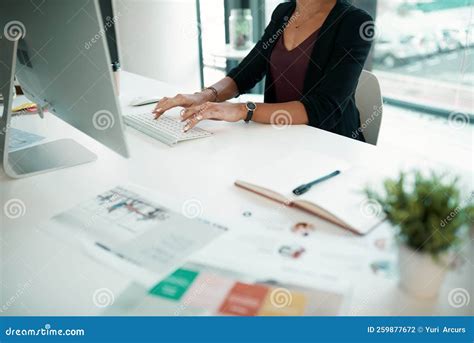 Updating All The Files On The System An Unrecognizable Businesswoman Sitting Alone In Her