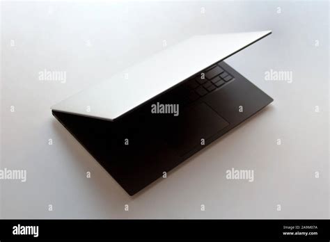 Half Closed Laptop Computer Isolated On White Background Stock Photo
