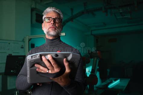 Automation Engineer Technician Holding Remote Controller Of Robotic Arm Concept Of Modern