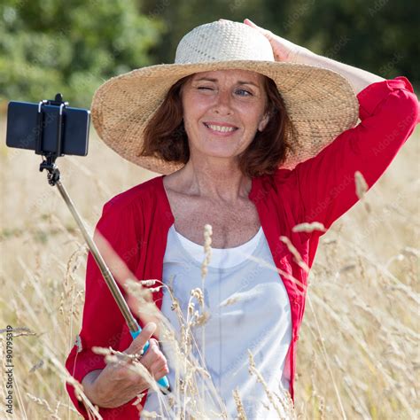 Mature Selfie Concept Cheerful Mature Woman Posing For Selfie With A