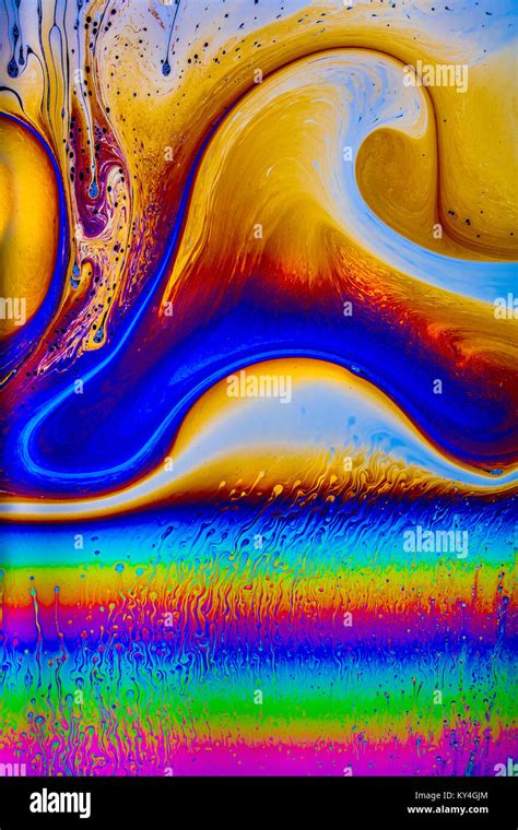 Optical Thin Film Interference Patterns In A Stretched Soap Solution Demonstrating Multi Colour