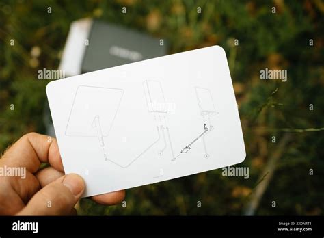 frankfurt germany jun 15 2023 a hand holding an instruction card detailing how to connect