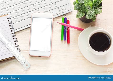 Office Workspace With Keyboard Notepad Coffee Of Cup And Smartphone On Wood Table Stock Image