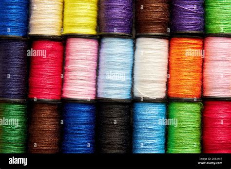 Background Pattern Of Set Of Colorful Rainbow Sew Thread Spools On The