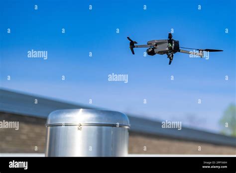 Drone Being Used To Perform An Aerial Inspecting Of Hvac Rtu Equipment On A Commercial Roof