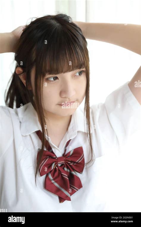 Portrait Japanese School Girl Uniform In White Tone Bed Room Stock