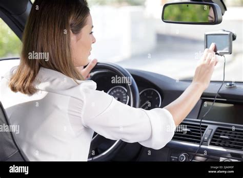 Woman Using Gps Navigation System In Car Stock Photo Alamy