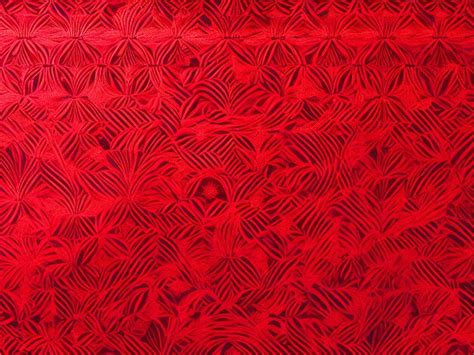 Premium AI Image Red Background Comes To Life With Intricate Patterns And Textures Image Download