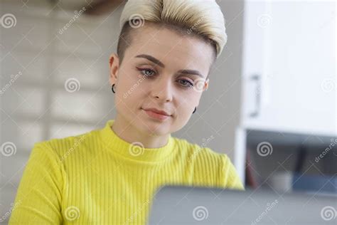Portrait Of Female Programmer Coding On Computer At Home Young Woman With Short Hair Works