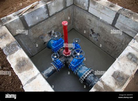 Gate Valves In Valve Pit Of The Underground Piping Networks Laying Water System Pipeline At
