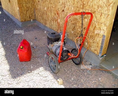 A Portable Generator Mounted Onto A Homemade Wheeled Dolly To Make It Easier To Move Around A