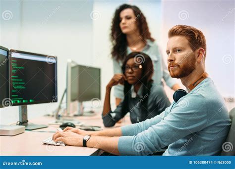 Software Engineers Working On Project And Programming In Company Stock