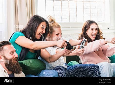 An Exuberant Group Of Friends Are Caught In A Moment Of Playful