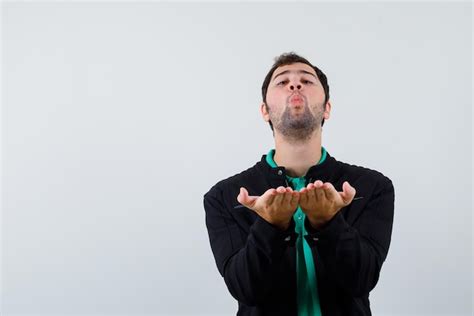 Free Photo Young Man Sending Kisses On White Background