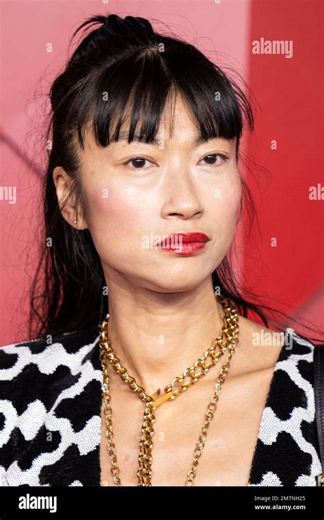 Mimi Xu Poses For Photographers Upon Arrival At The British Fashion
