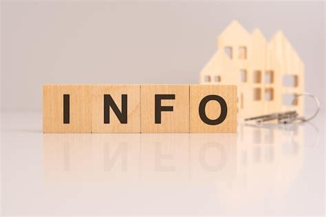 Premium Photo Wooden Cubes On A Table With Text INFO Model House And Keys On Background