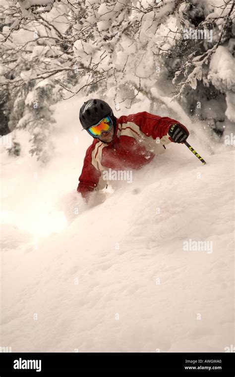 Skier John Egan Kicks Up The Snow As He Enjoys The Powder At Sugarbuh Resorts Mt Ellen In