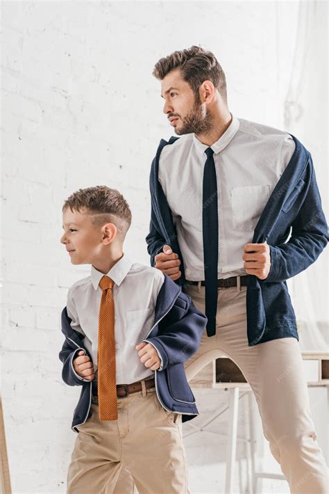 Premium Photo Confident Dad And Son In Formal Wear At Home