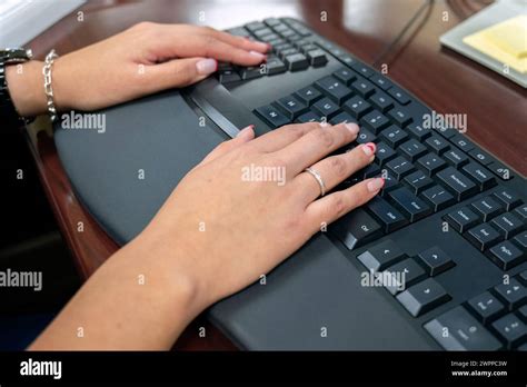 Feminine Hands Entering Keystrokes On The Keyboard For Statistical Data Analysis Stock Photo Alamy